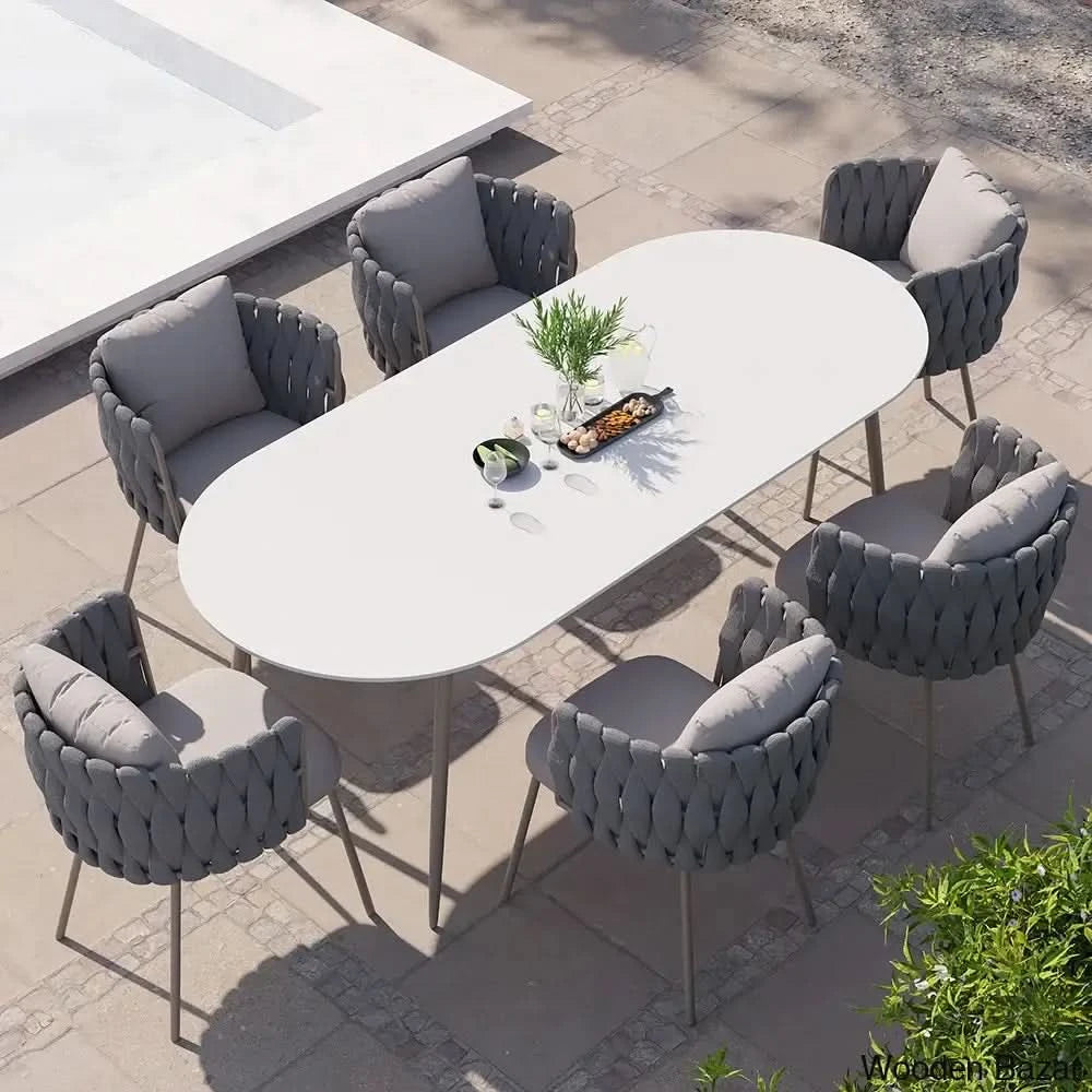 Delsie 6 seater Oval Faux Marble Outdoor Dining Set with Rope Woven Ar